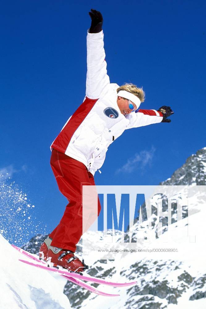 Skiboarderin mit Big Air vor blauem Himmel Skiboarding Damen Skiboard ...