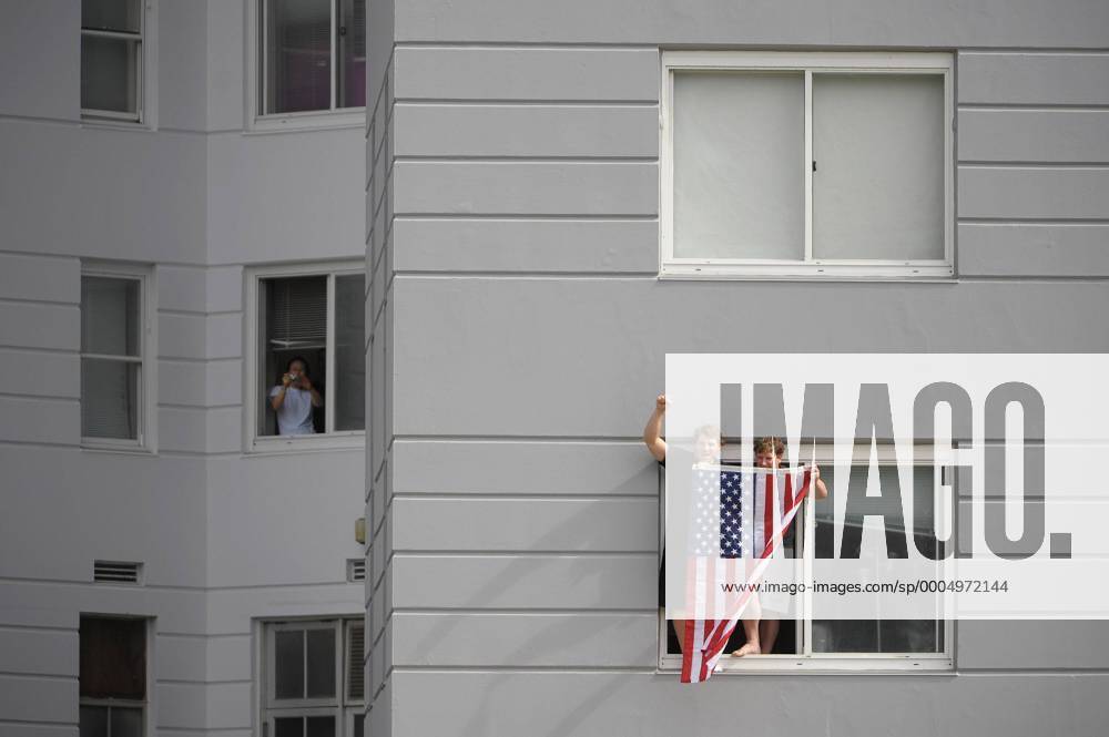 USA fans cheer on their team from a building near the 4th tee box ...