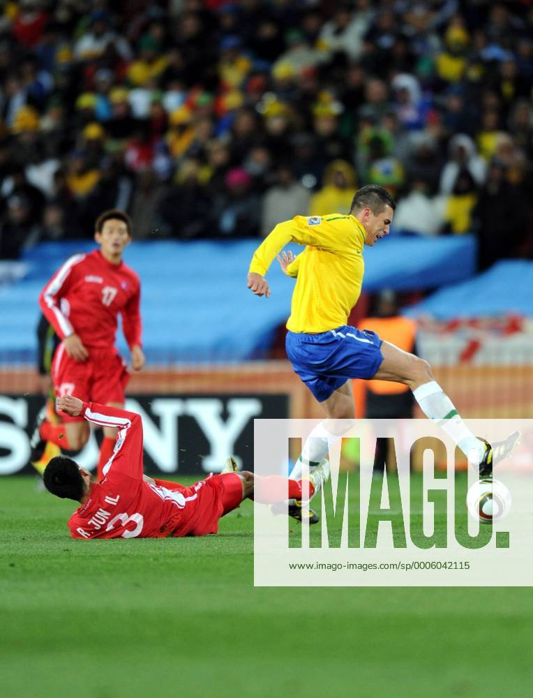 Ri Jun-Il of DPR Korea tackles Lucio during the Group G first round ...