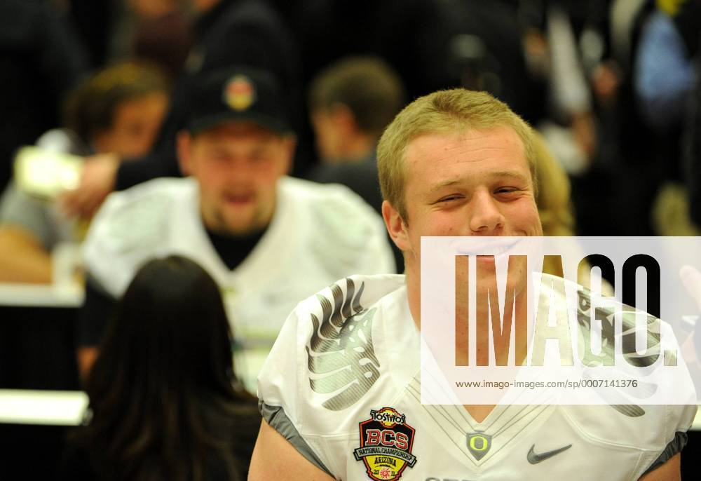 Oregon Ducks guard Carson York (R) reacts to a question as he is ...