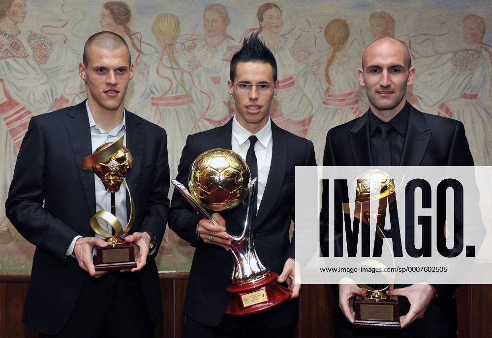 Slovak soccer player Marek Hamsik, middle, is awarded with the Jan ...