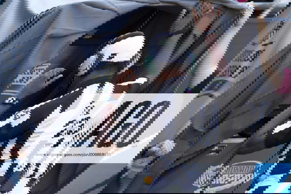 October 23, 2011: Referee Jerome Boger (23) goes under the hood to ...