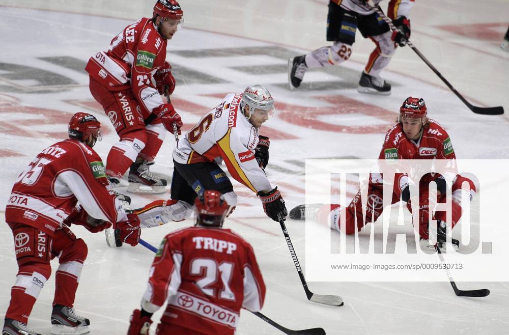 Düsseldorf s Andrew Hedlund against four players of Köln during the ...