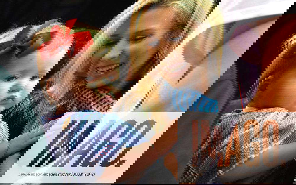 Eleven-month-old Ava Frances Manning is held by her mom Abby as she ...