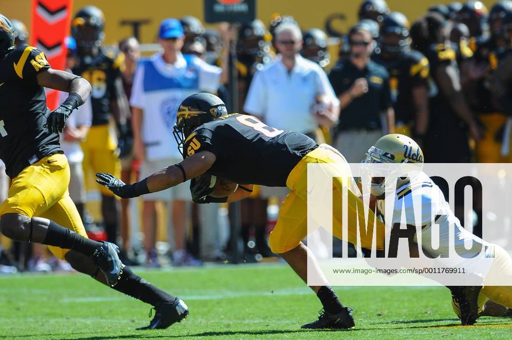 Oct. 27, 2012 - Tempe, Arizona, U.S. - DJ FOSTER (8) RB is tackled in ...