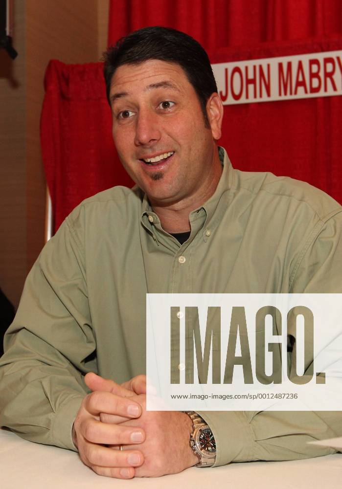 St. Louis Cardinals hitting coach John Mabry talks with fans during the ...