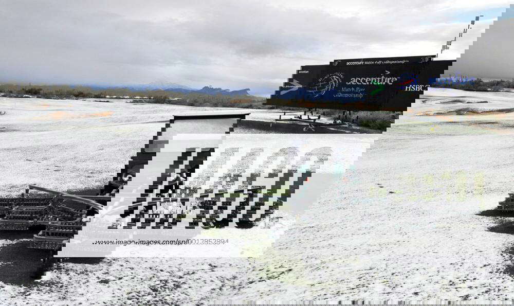 A driving range tractor sits in the show that suspended the first round ...