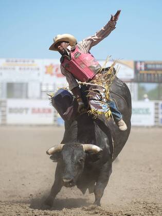 April 14, 2013 - Oakdale, California, USA - Bull rider Christopher Byrd ...