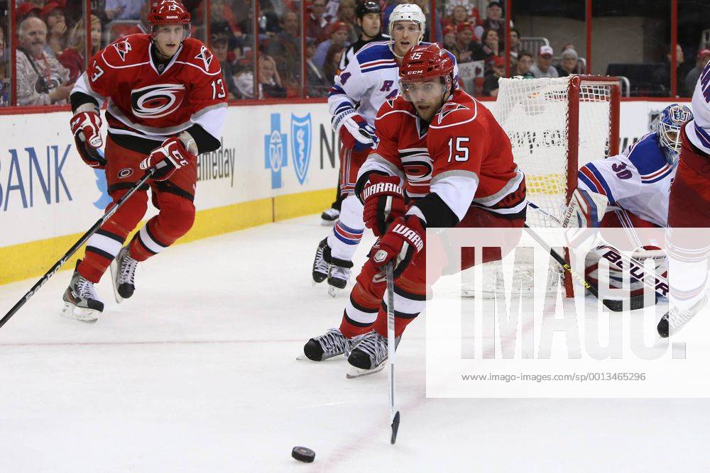 25 April 2013: Carolina s Tuomo Ruutu (FIN) (15) reaches for the puck ...