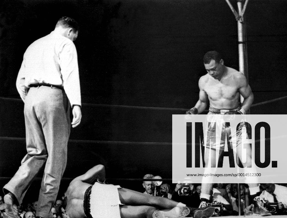 Joe Louis knocking out Jersey Joe Walcott to retain his World ...