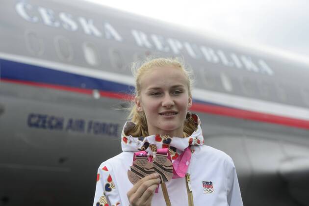 Members of the Czech team pose with medals from the Olympic Games of ...