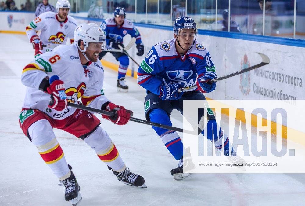 ITAR-TASS: TOGLIATTI, RUSSIA. Jokerit s Topi Jaakola and Lada s Alexander Sharov in action in their