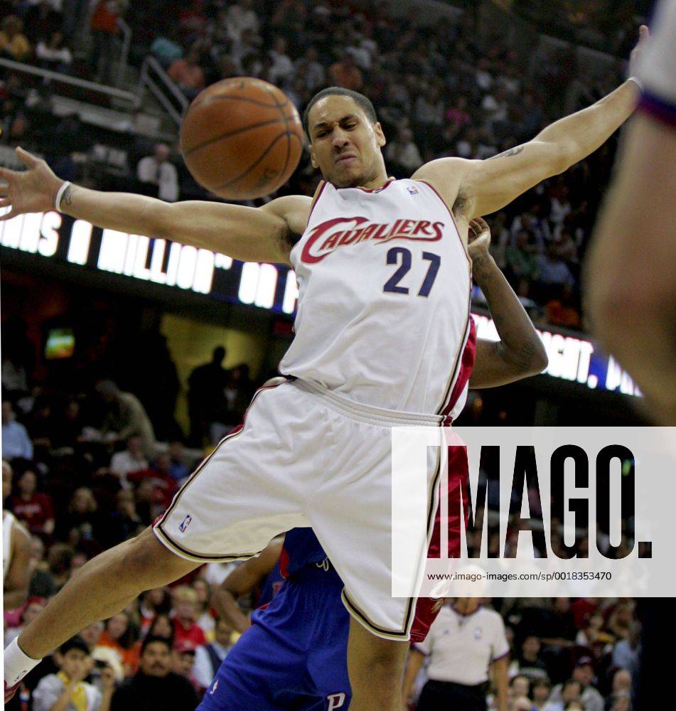 Cleveland Cavaliers forward Dwayne Jones, center, is fouled from behind ...