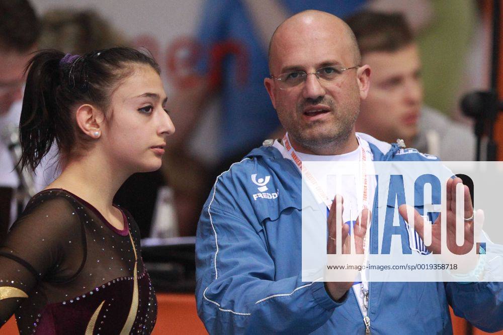 Maria Simou, GRE, and her coach (Apostolos Pesingis?), during ...