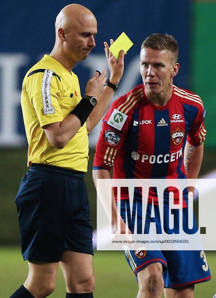 MOSCOW REGION, RUSSIA. APRIL 8, 2015. Referee Sergei Karasyov (L) gives ...