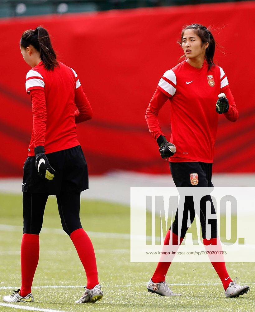 Zhao Lina (R), goalie of China, attends a training session ahead of the ...