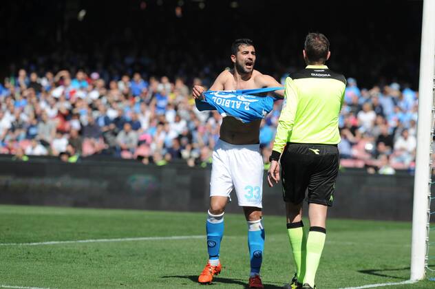 Naples, Italy - Napoli defender Raul Albiol shows his ripped jersey to ...