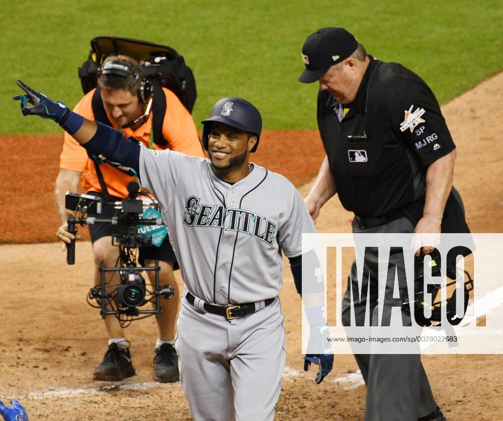 Seattle Mariners Robinson Cano celebrates hitting a solo home run in ...
