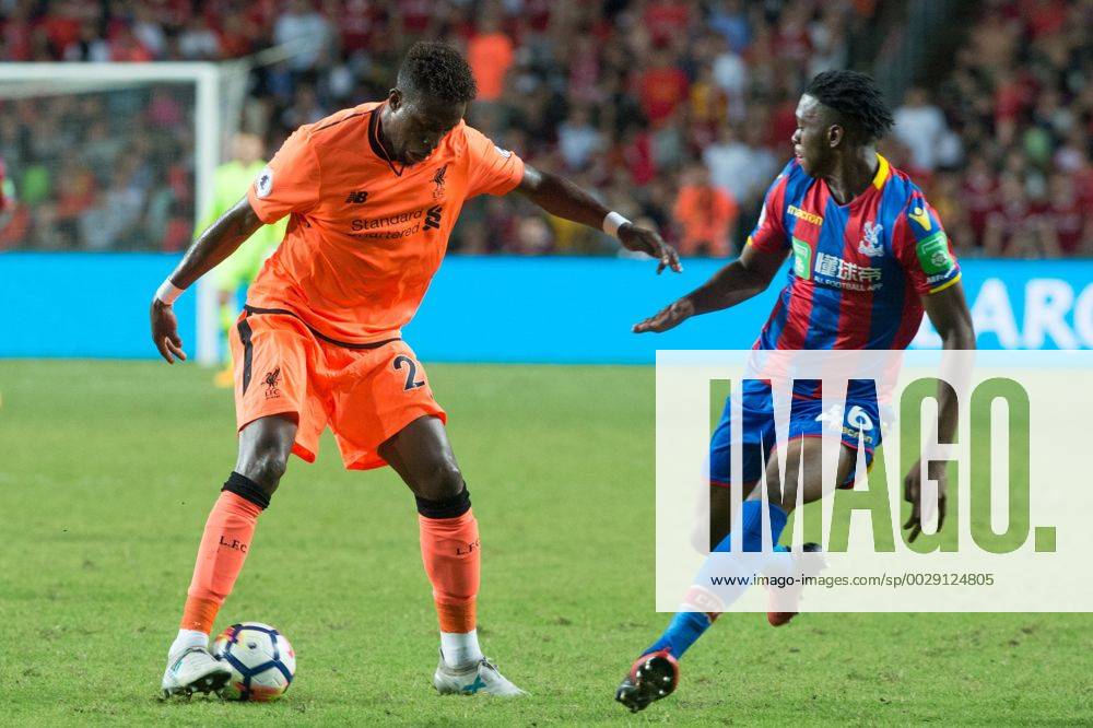 Nathaniel Clyne of Liverpool F.C., left, challenges Aaron Wan-Bissaka ...