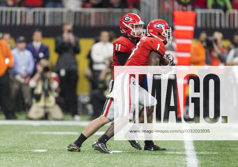 January 08, 2018: Georgia quarterback Jake Fromm (11) hands the ball ...