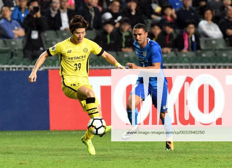 Fernando, back, of Hong Kong s Kitchee SC challenges Masashi Kamekawa ...
