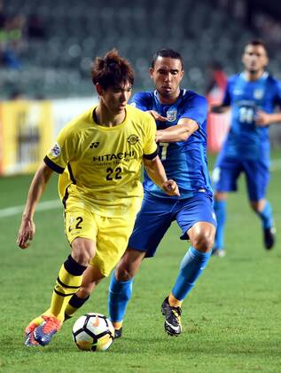 Fernando, back, of Hong Kong s Kitchee SC challenges Masashi Kamekawa ...