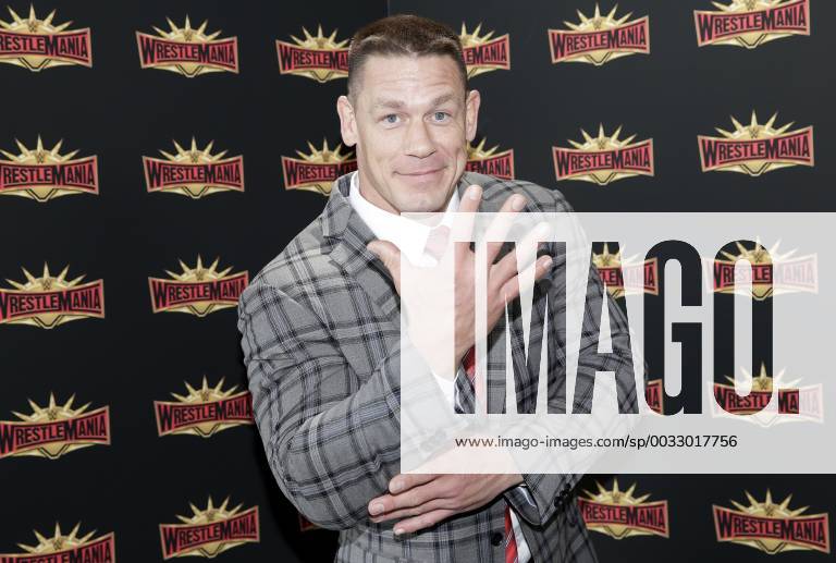 John Cena arrives for interviews after a news conference to officially ...