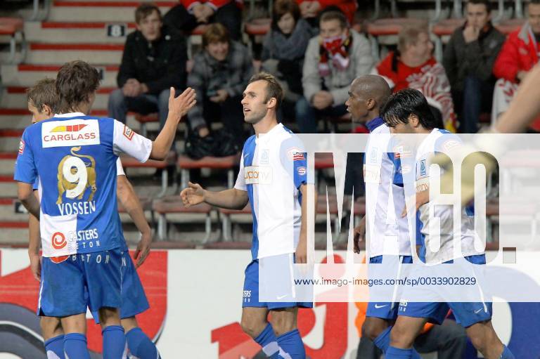 - LIEGE, BELGIUM: Genk s Thomas Buffel (C) celebrates with teammates ...