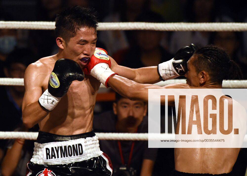 Raymond Poon Kai-ching of Hong Kong, left, competes against Ryo ...