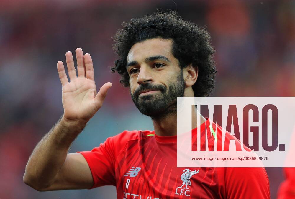 Liverpool s Mohamed Salah waves to fans during the pre-season friendly ...
