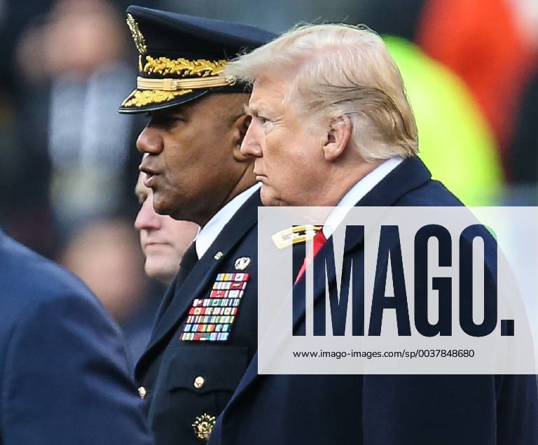 : President Trump attends the coin toss before an NCAA College League ...