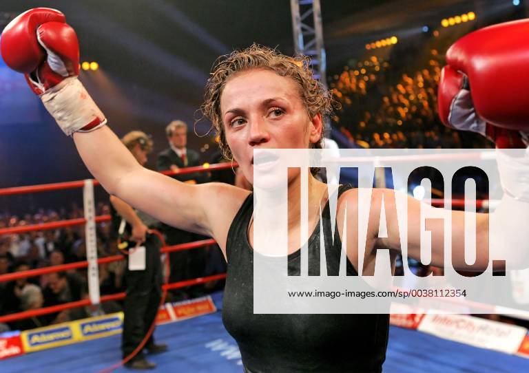 The German boxer Ina Menzer cheers after her victory in the fight for ...