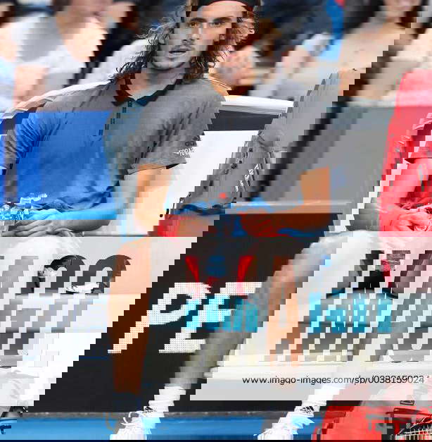 Stefanos Tsitsipas sits on the bench during the game break