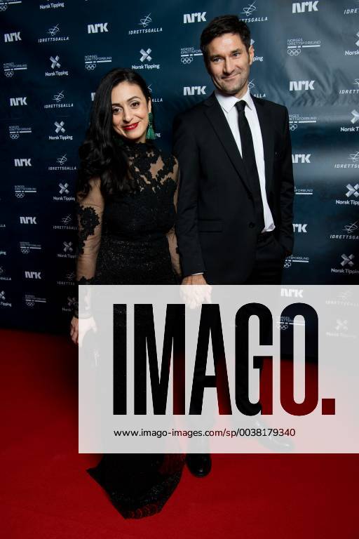 Hadia Tajik and Kristian Skard bag for a photo on the red carpet during sports event 2019 on