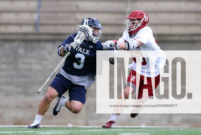 BOSTON, MA - APRIL 27: Harvard Crimson Nick Loring (10) defends Yale ...