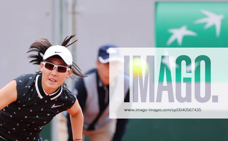 Paris, Zheng Saisai of China serves during the women s singles first round match with Wang Qiang of