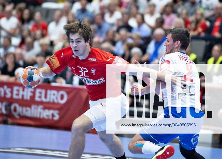 Denmarks Jacob Holm against the Faeroe Islands Helgi Hoydal Hildarson ...