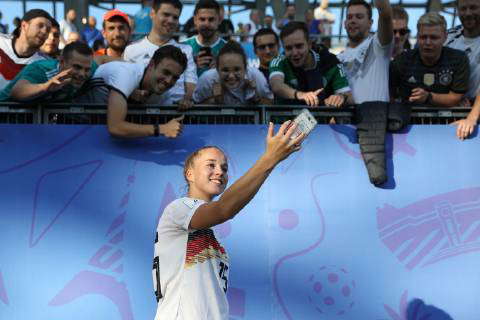 GRENOBLE, Giulia Gwinn of Germany takes a selfie photo with spectators ...