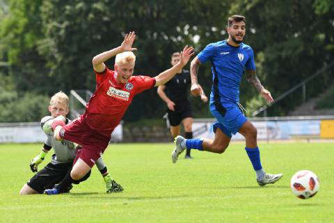 Daniel Bux 15, VfR Aalen is fouled by Ruben Volkert 16, SGV Freiberg ...
