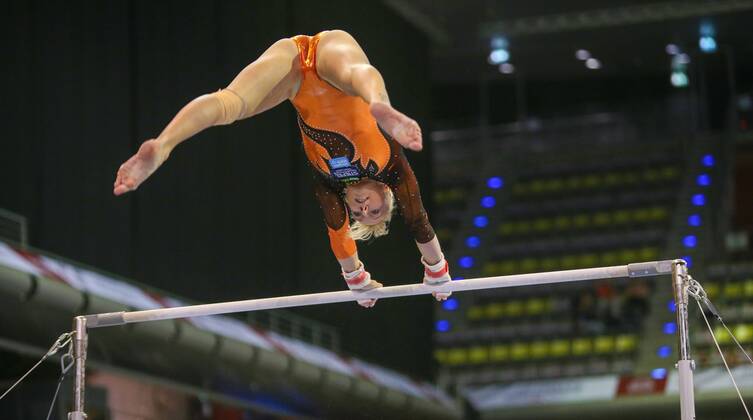Janine Berger on uneven bars at the German Championships in apparatus ...