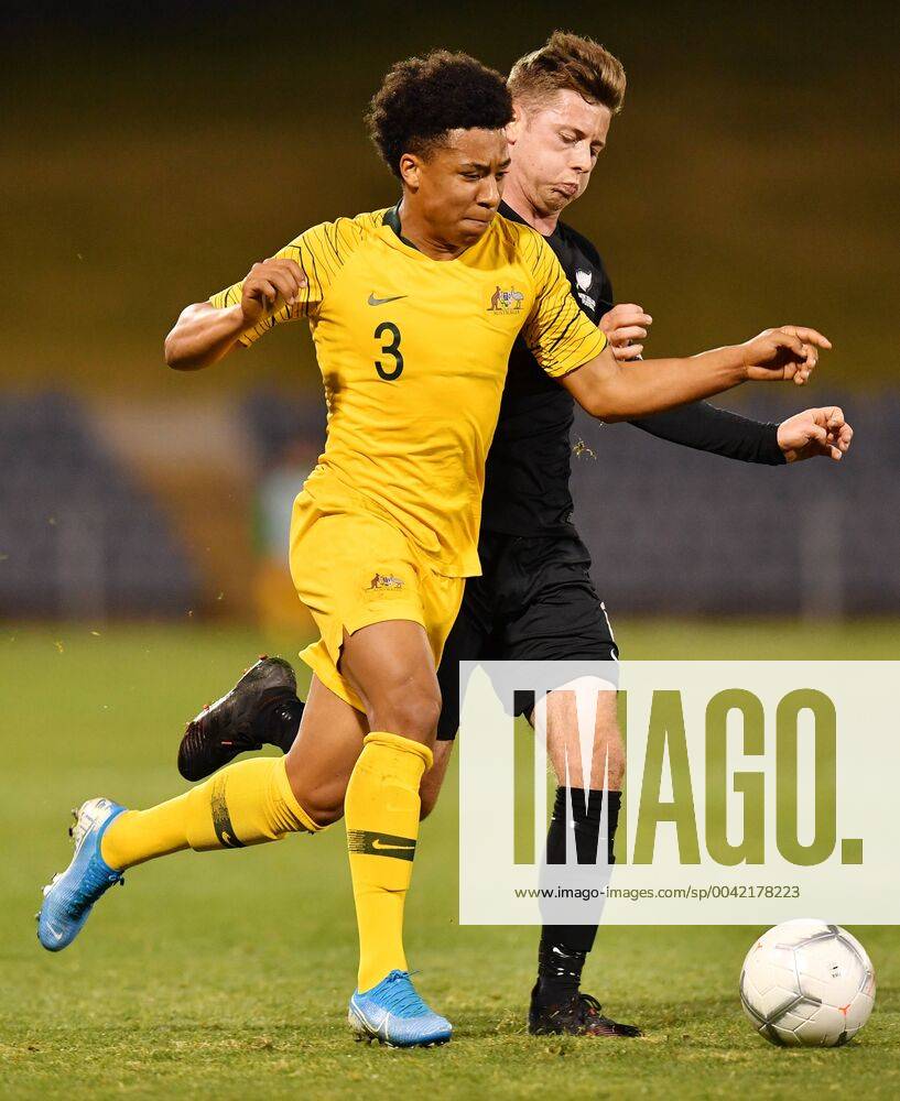 FFA U23 AUSTRALIA NZ, Samuel Silvera of Australia is tackled by Jake ...