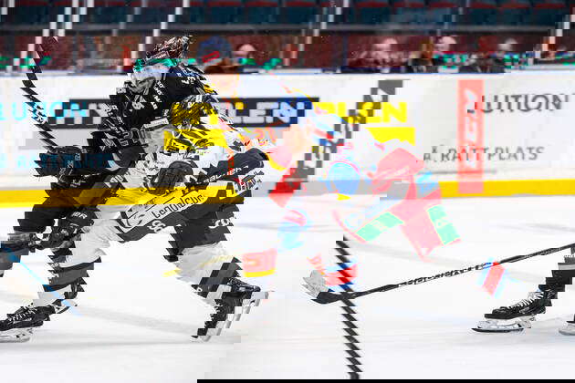 Djurgardens Patrik Berglund and Skellefteas Petter Granberg in a crash during the ice hockey match