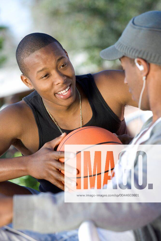 Two Young Men with Basketball, Talking
