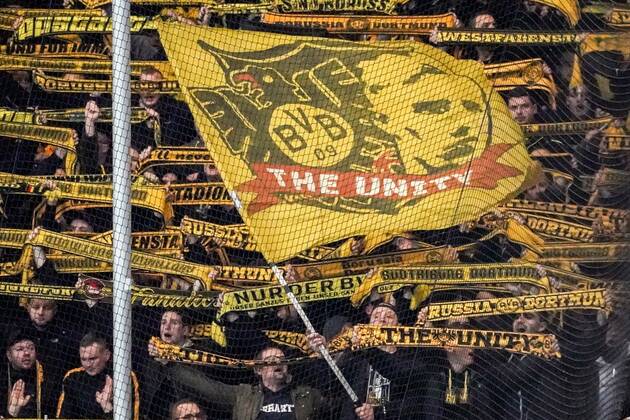 The traveling Ultras of Borussia Dortmund BVB 09 in the guest block ...