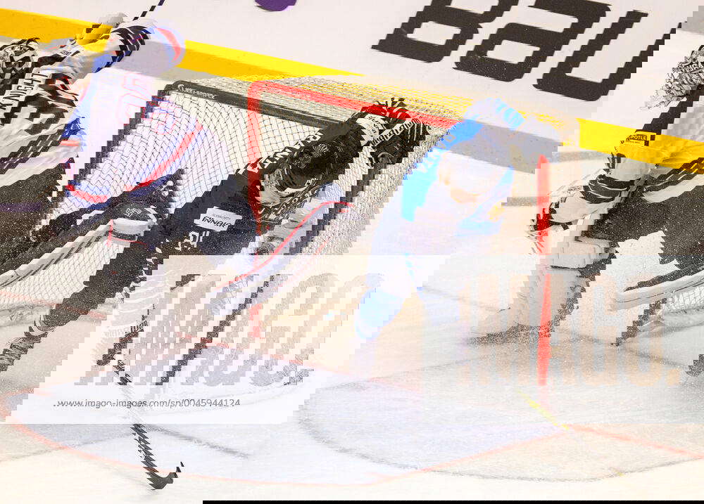 Spencer Knight, goalkeeper of USA, left, and Sampo Ranta of Finland in action during the 2020 IIHF