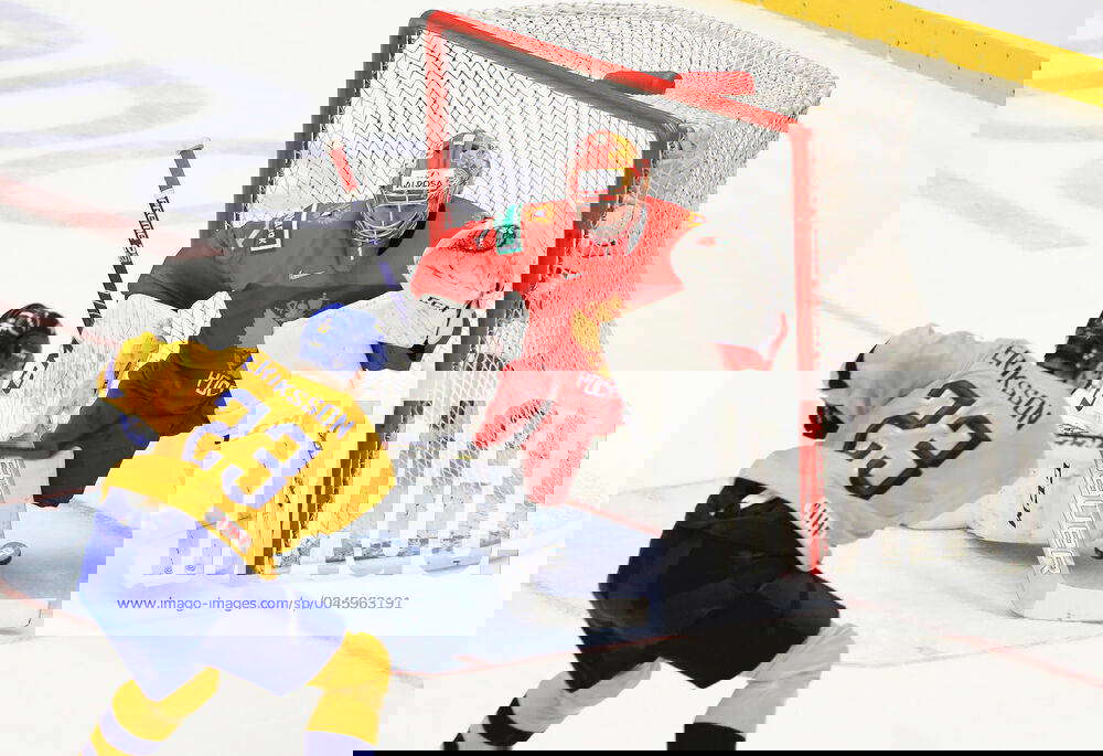 OSTRAVA, CZECH REPUBLIC - : Sweden s Albin Eriksson and Russia s goalie ...