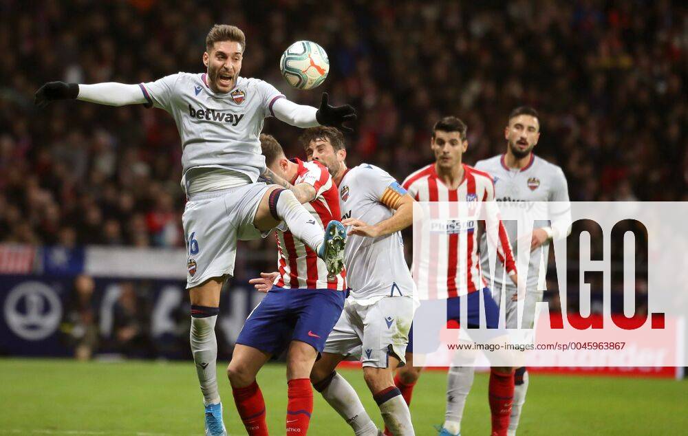 Levante s forward Ruben Rochina (L) heads the ball during the Spanish ...
