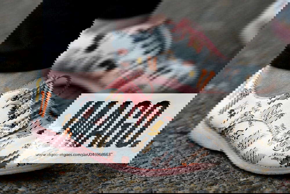 JANE MCGRATH HIGH TEA, Shoes with illustrations of breasts are seen at ...