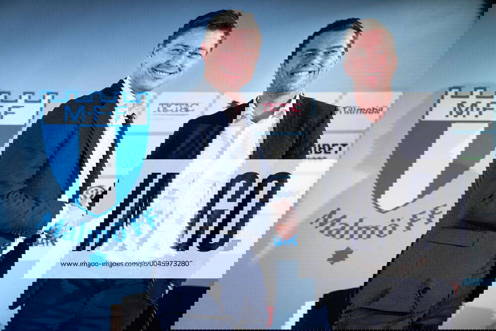 Jon Dahl Tomasson shakes hands with Daniel Andersson, Sports Manager at Malmoe FF, for the press