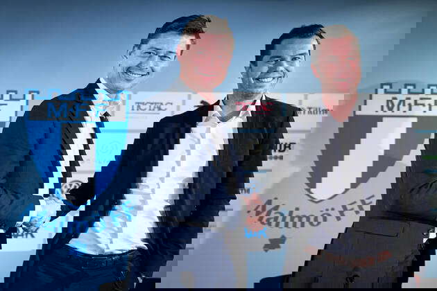 Jon Dahl Tomasson shakes hands with Daniel Andersson, Sports Manager at Malmoe FF, for the press